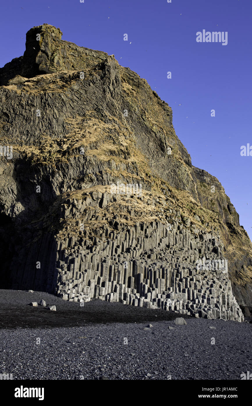 Reynisdrangar, basalt sea stacks situated under the mountain ...