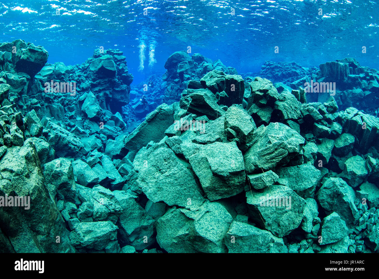 Scuba divers at Davíðsgjá, like Silfra, is a fissure located in Lake ...