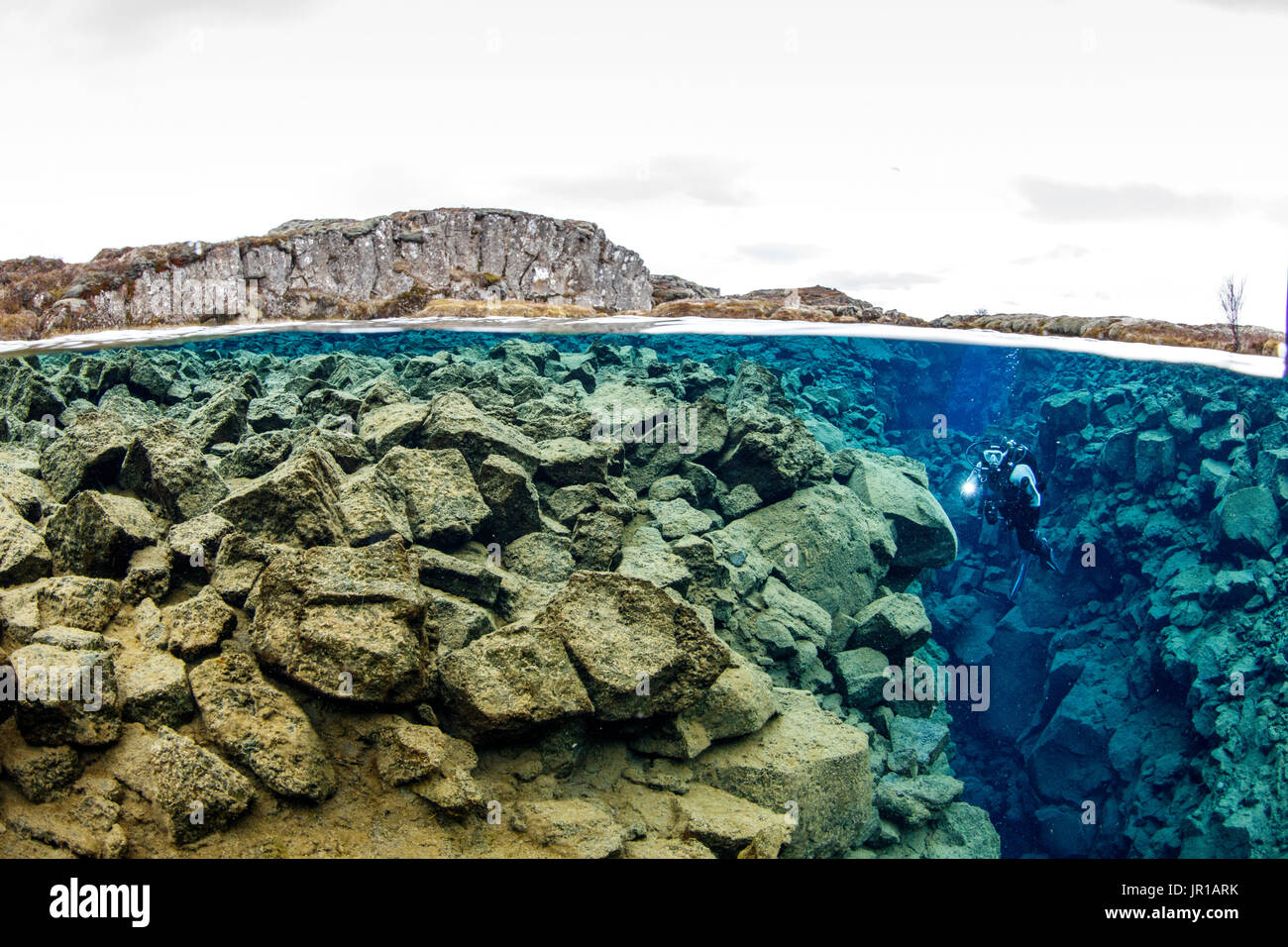 Diver explores the Silfra Hall a part of the crack that leads to the ...