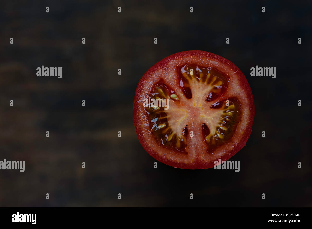 Tomato sliced half viewed from the top Stock Photo - Alamy