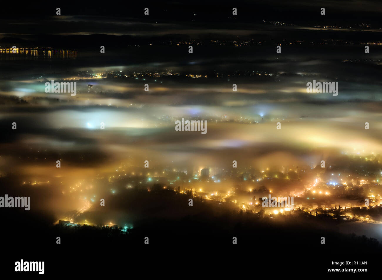 Fog and light pollution in Geneva, Switzerland Stock Photo - Alamy