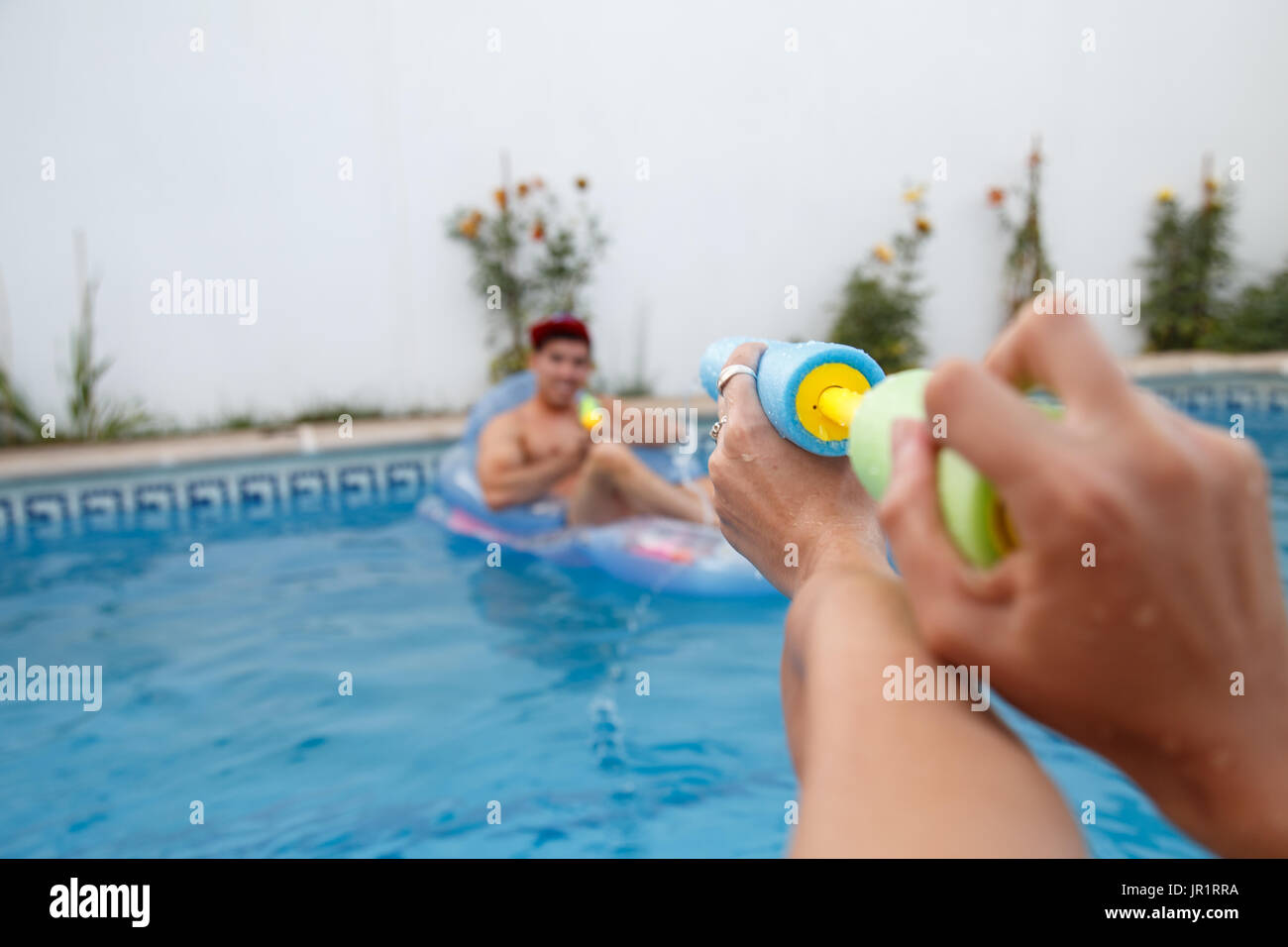 Cheerful people playing shooting hi-res stock photography and images ...