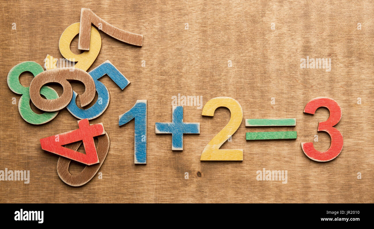 Colorful wooden numbers on wooden background Stock Photo - Alamy