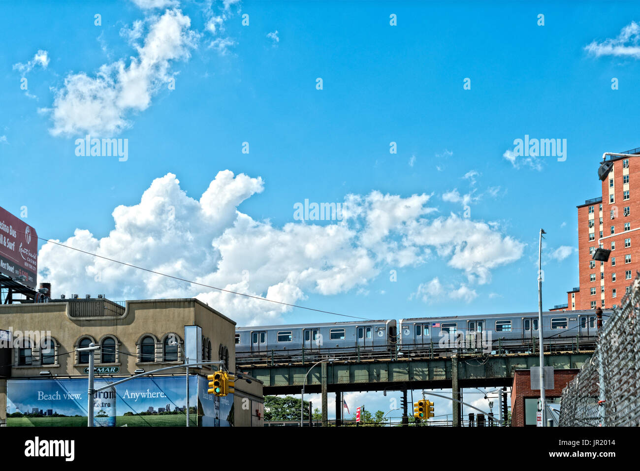 Elevated Subway Train Passing Through Coney Island, Brooklyn, NY, USA ...