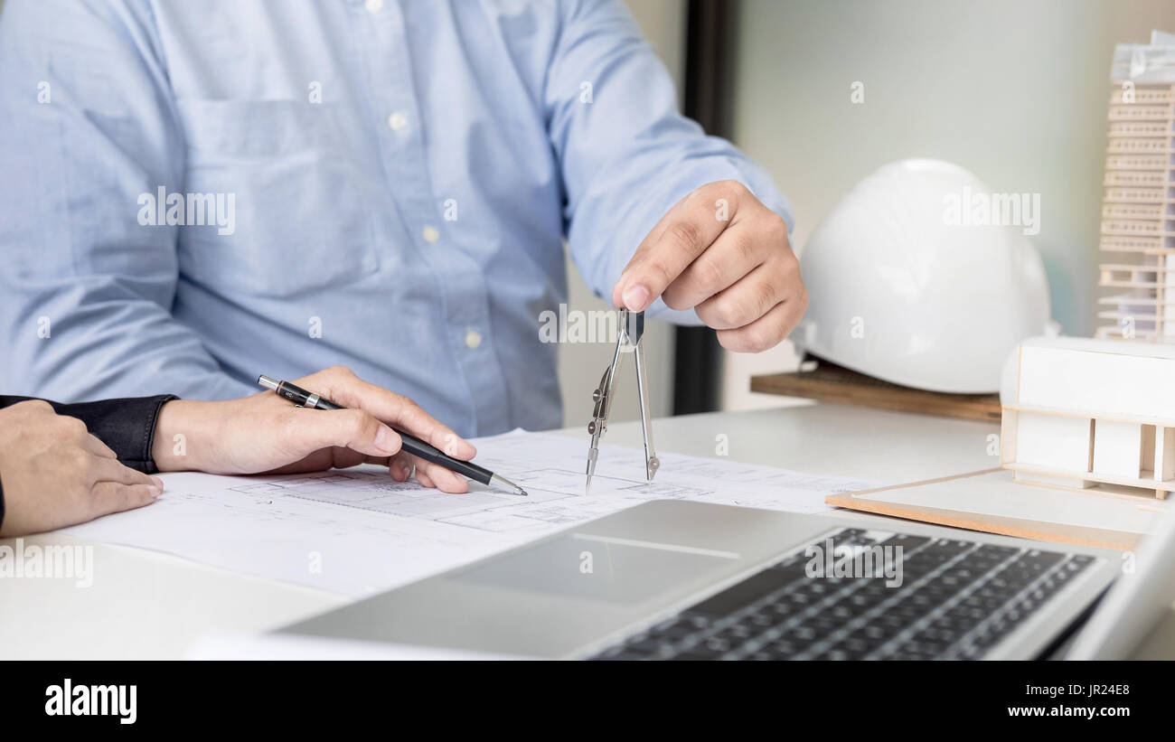 Person's engineer Hand Drawing Plan On Blue Print with architect ...