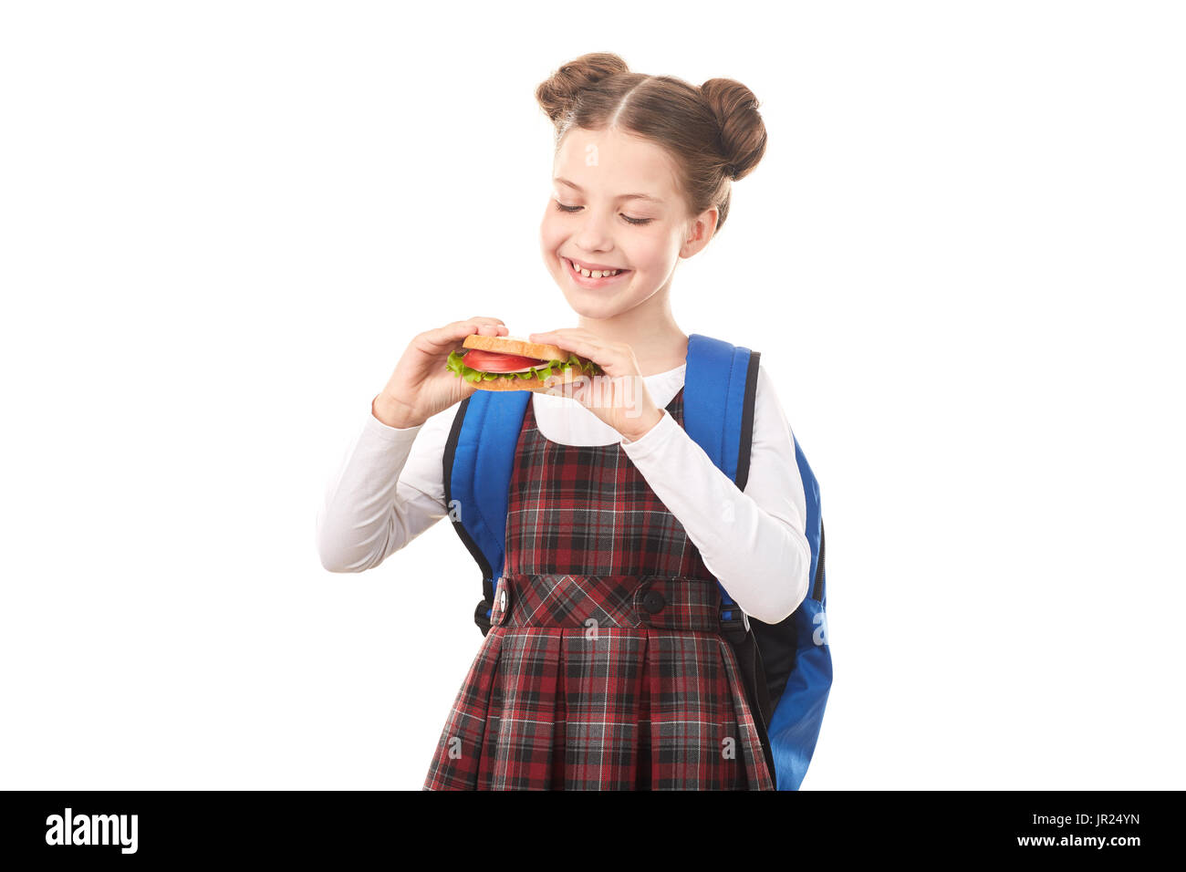 School girl eating sandwich Stock Photo - Alamy