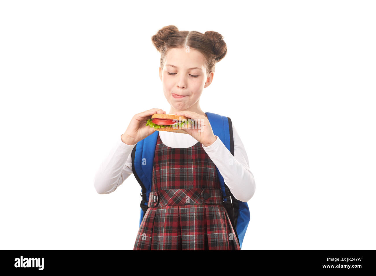 School girl eating sandwich Stock Photo - Alamy