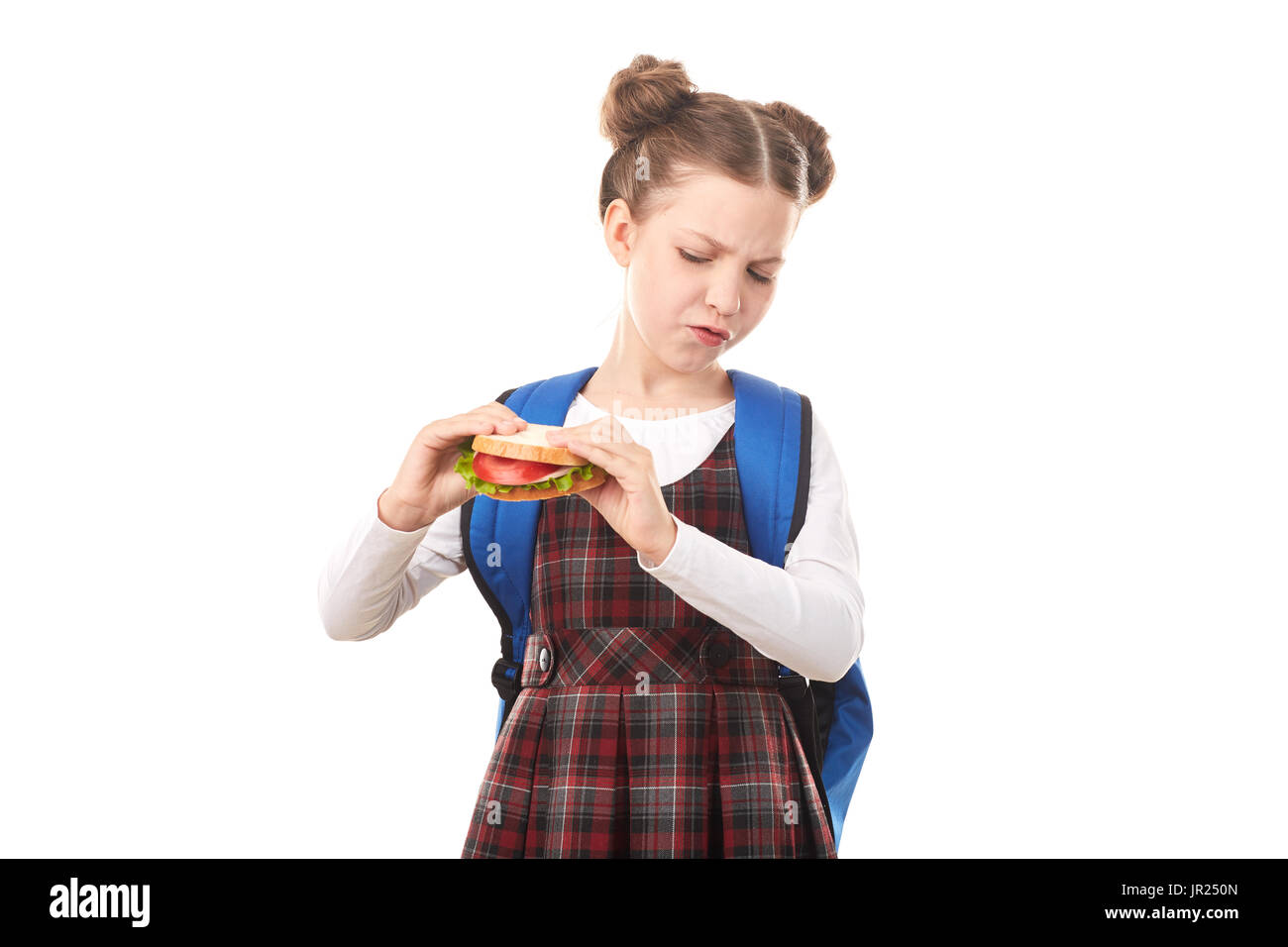 School girl eating sandwich Stock Photo - Alamy