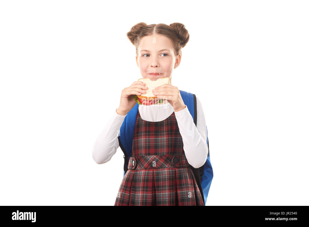 School girl eating sandwich Stock Photo - Alamy