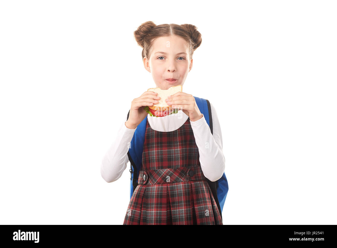 School girl eating sandwich Stock Photo - Alamy