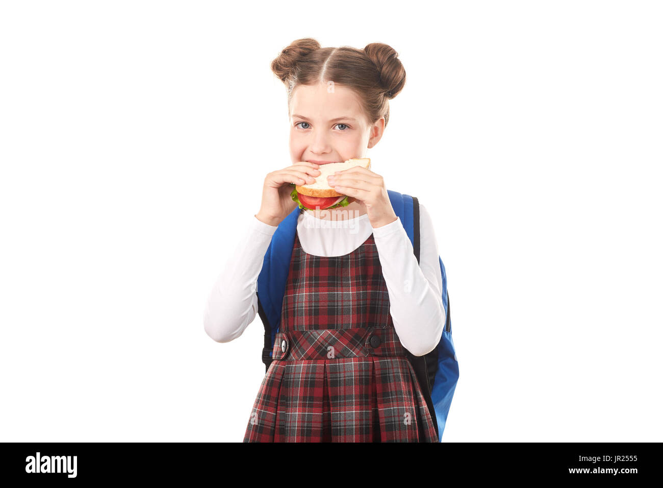School girl eating sandwich Stock Photo - Alamy