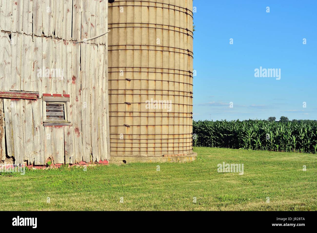Burlington, Illinois, USA. A venerable, weathered barn and silo ...