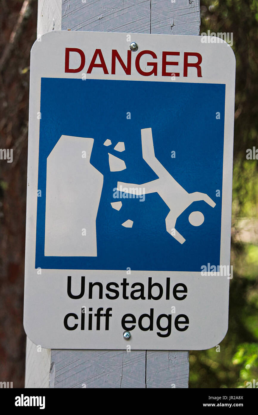 A danger unstable cliff edge sign Stock Photo - Alamy