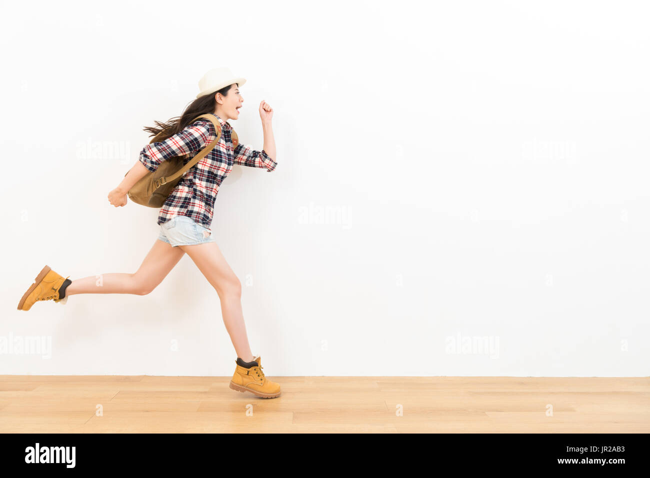 happy asian traveler on the wooden floor showing performance of the ...