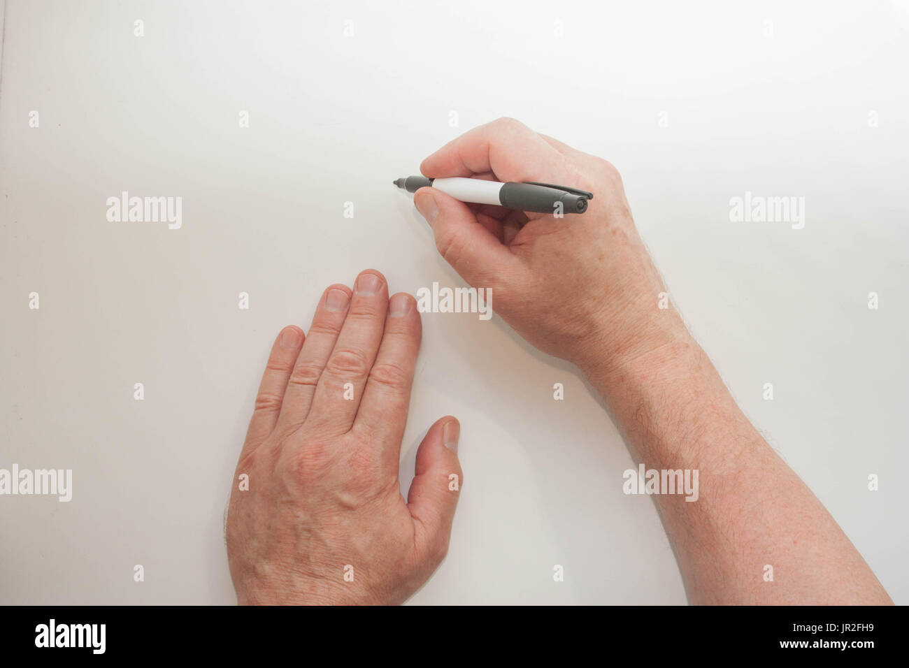 Hand and marker. Man's hand write marker on white with 2nd hand - palm ...