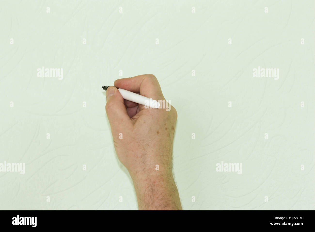 Hand and marker. Man's hand write Stock Photo - Alamy