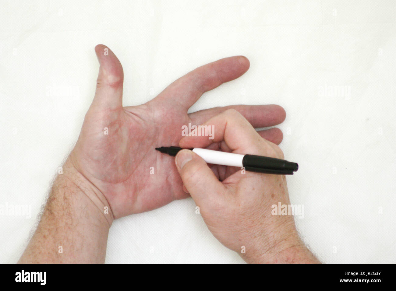 Hand and marker. A male hand writing Stock Photo - Alamy