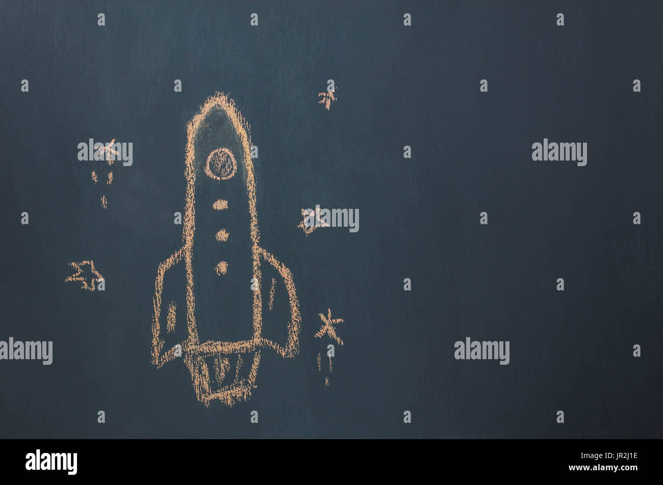 Top view / Flat lay Handmade drawing rocket ship launch / take off to ...