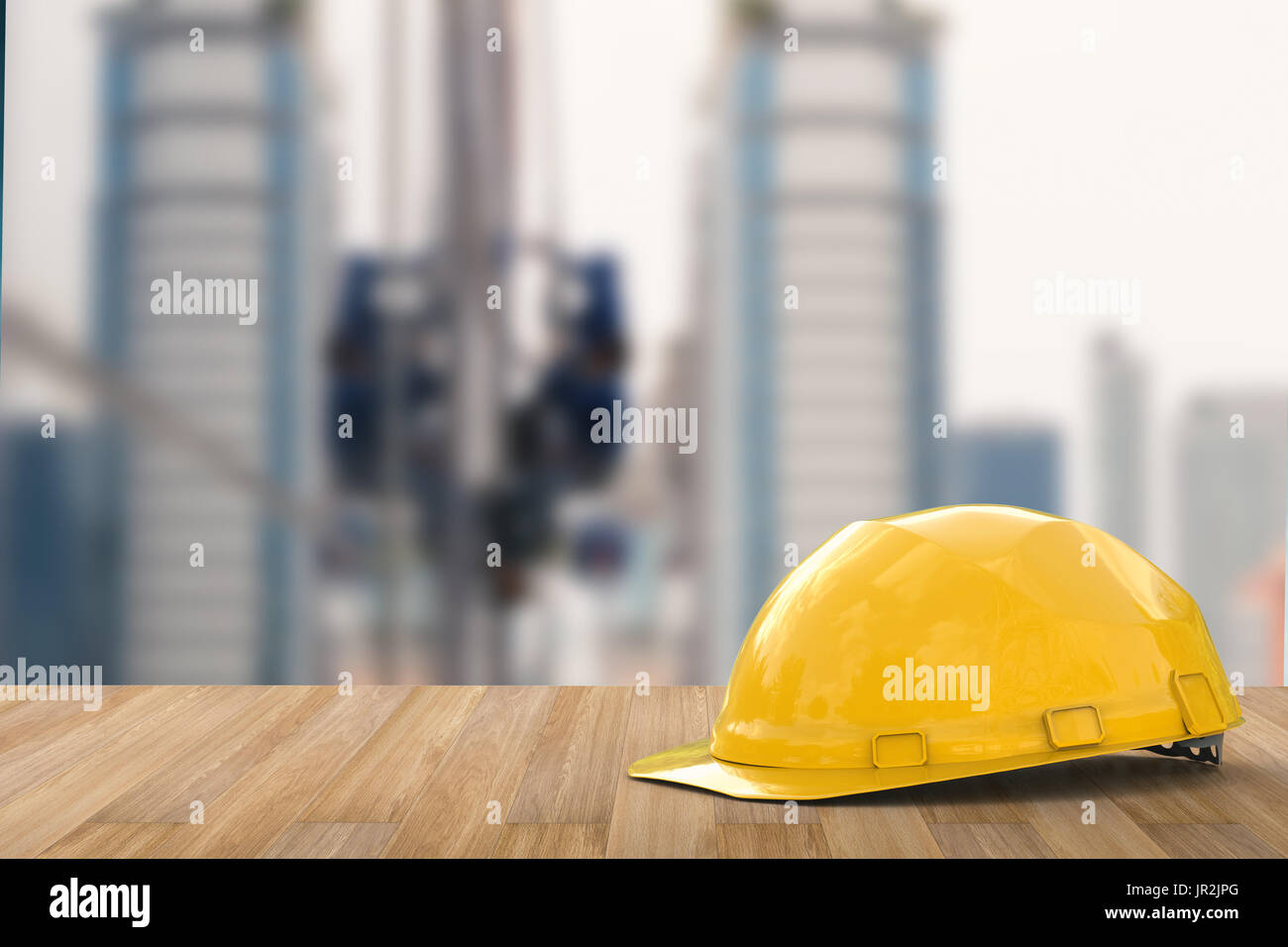 yellow safety helmet for construction worker Stock Photo - Alamy