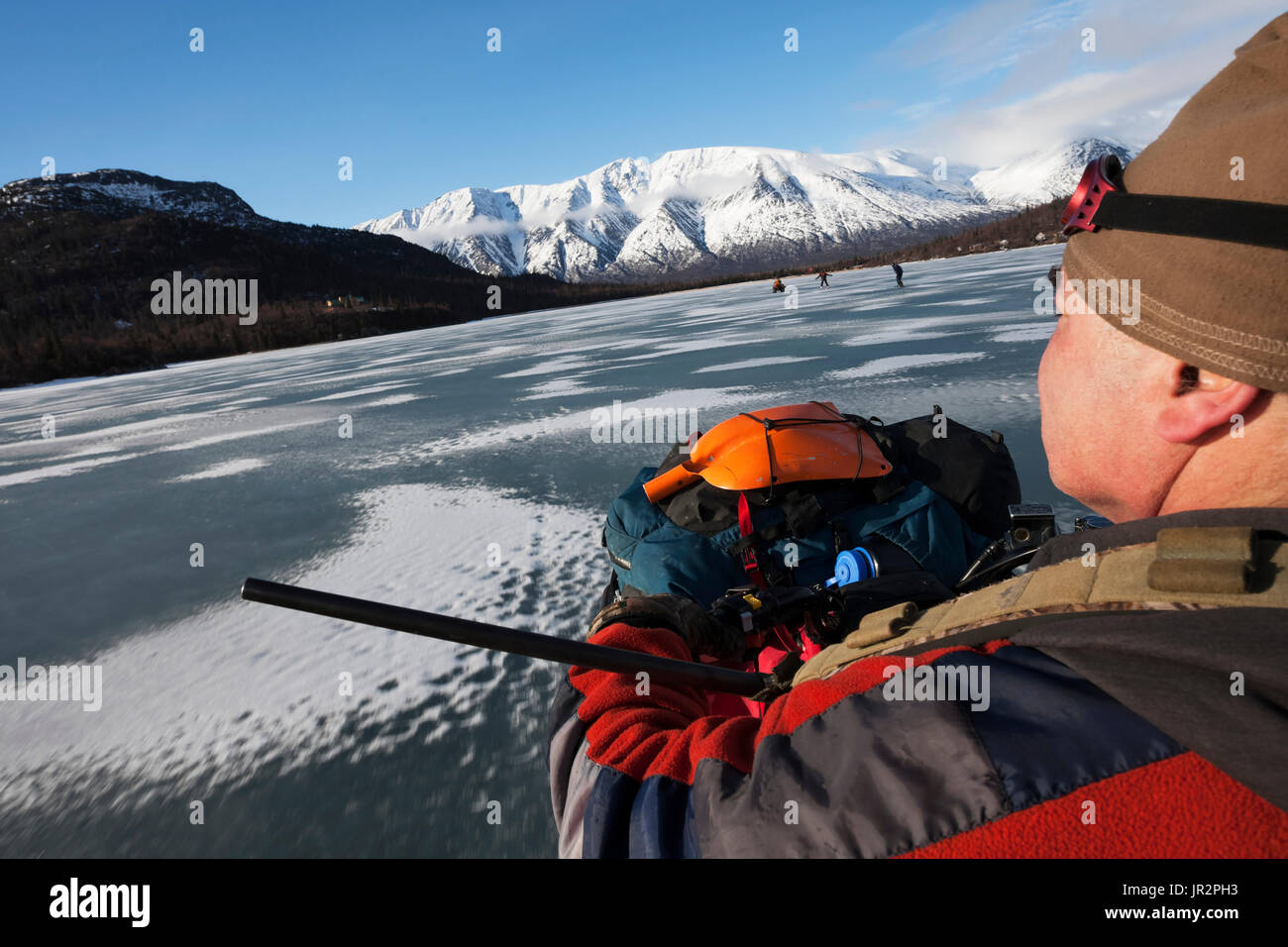 Hunter On An Atv During A Freshwater Harbor Seal Hunt, Lake Iliamna ...