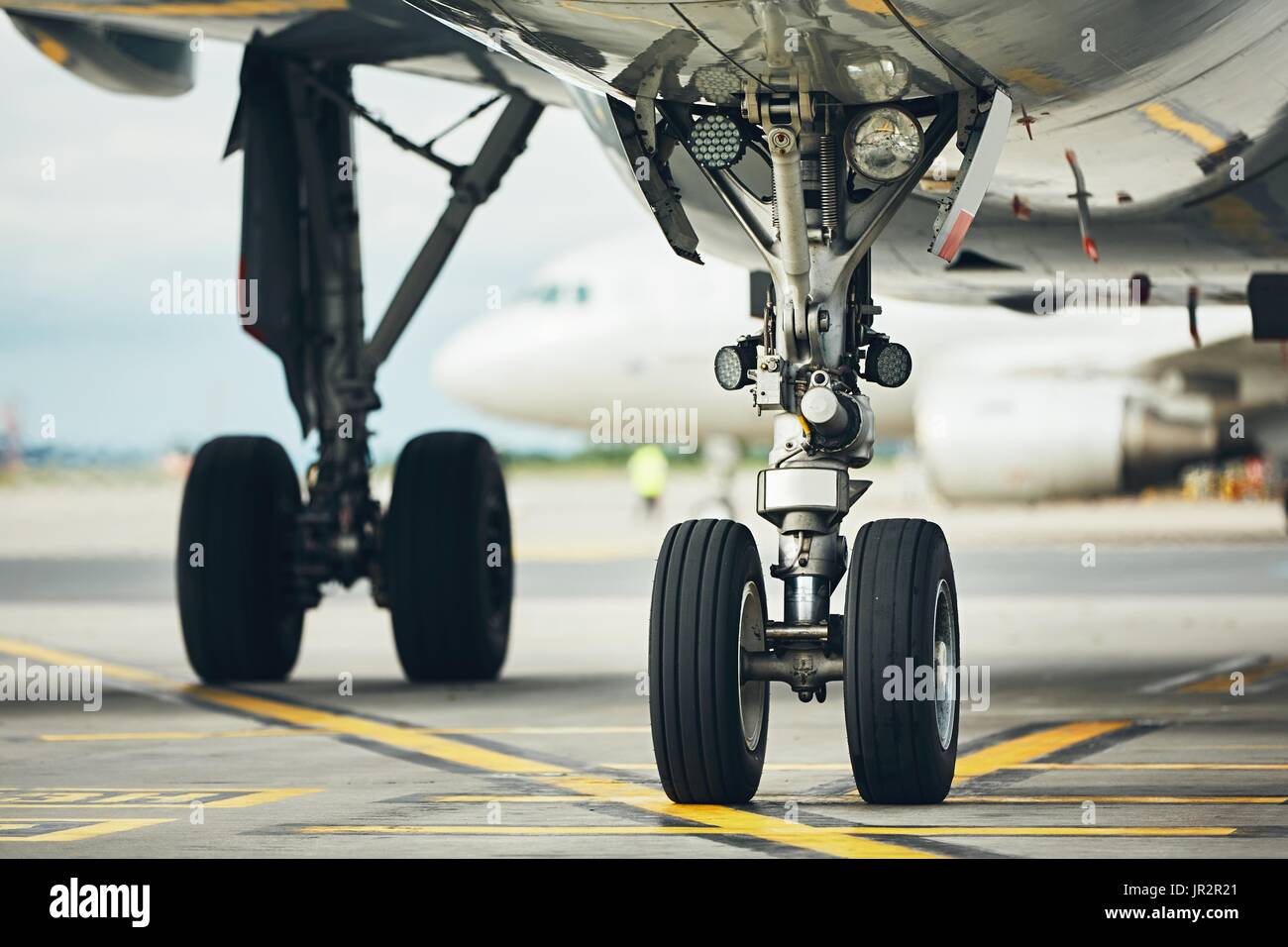 Chassis of the airplane. Plane taxiing from the runway to the gate ...