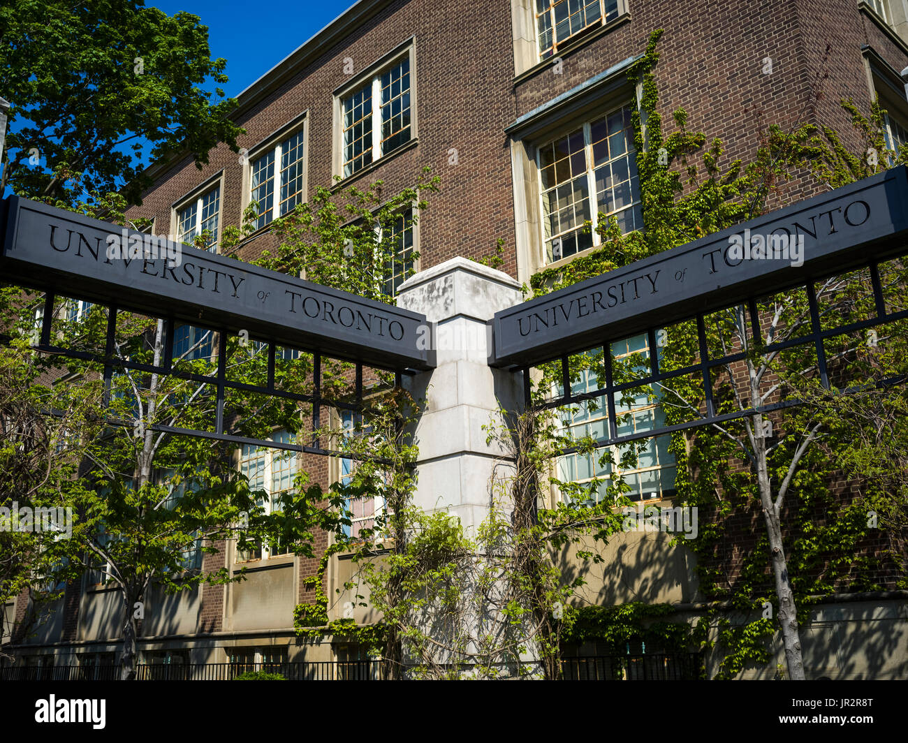 Signs For University Of Toronto Outside A Brick Building; Toronto ...