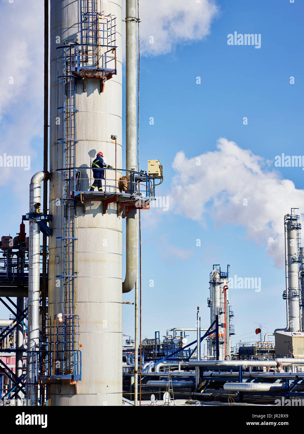A Tradesman Working On A Tower Platform At A Refinery; Edmonton ...