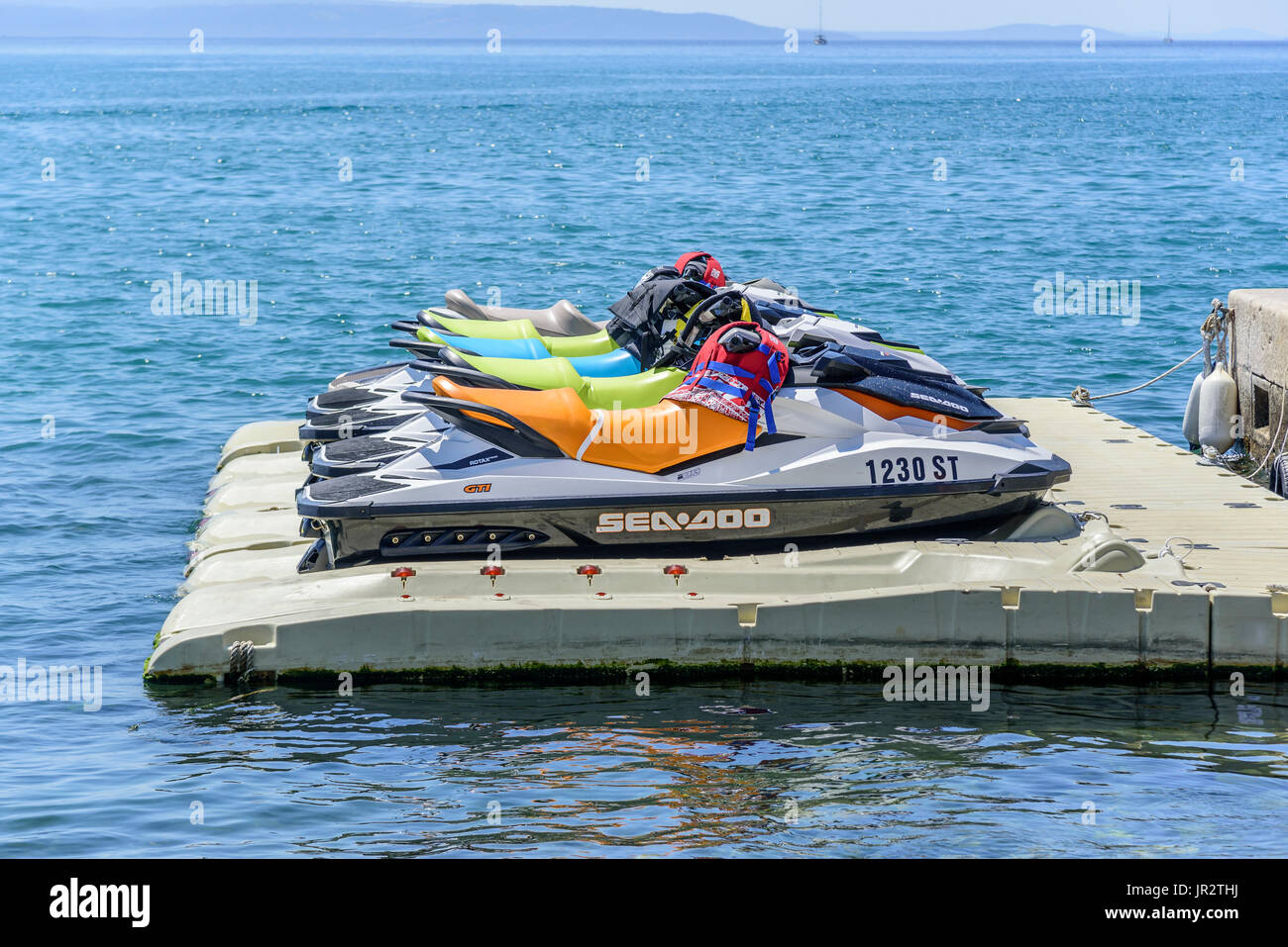 Water motorcycles are parked on the dock Stock Photo - Alamy