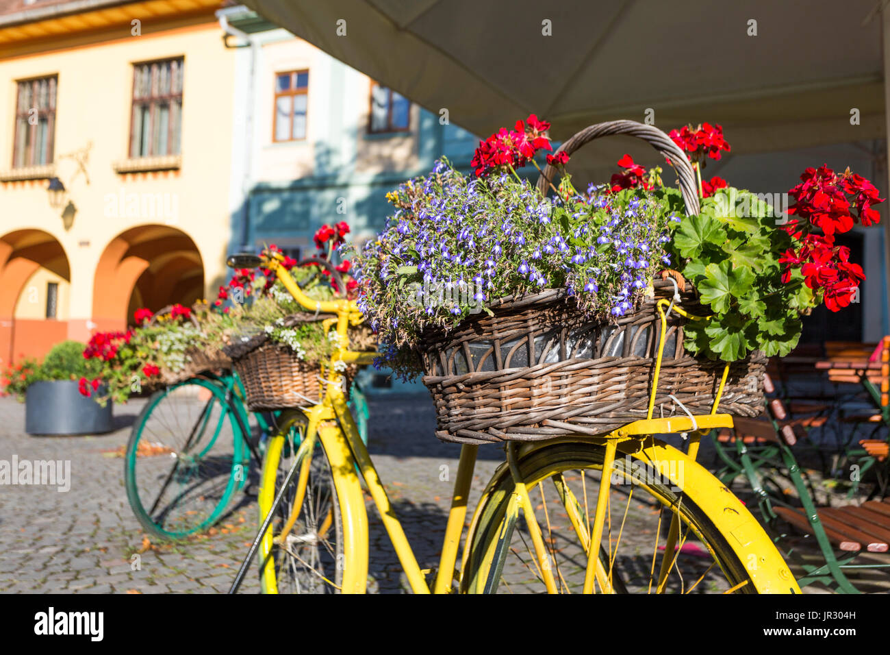 Colorful bicycle on the street of Sighisoara in Romania Stock Photo - Alamy