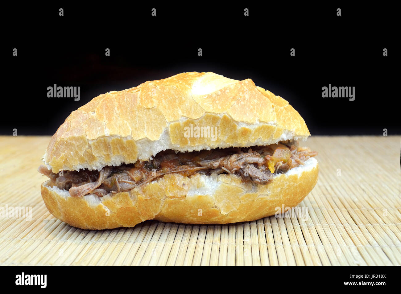 Brazilian meat sub isolated on black Stock Photo - Alamy