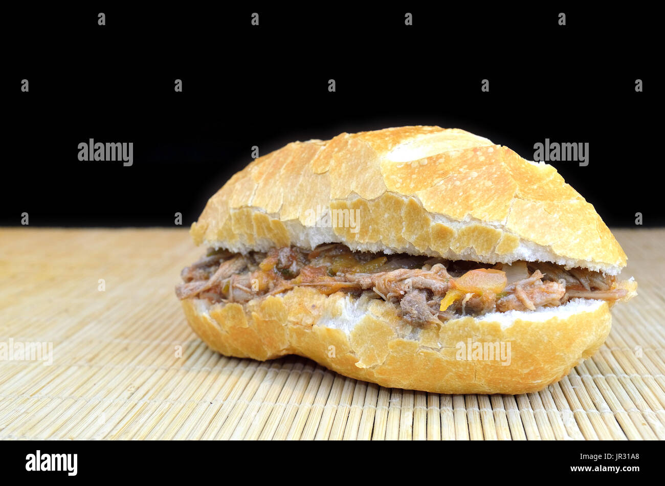 Brazilian meat sub isolated on black background Stock Photo - Alamy