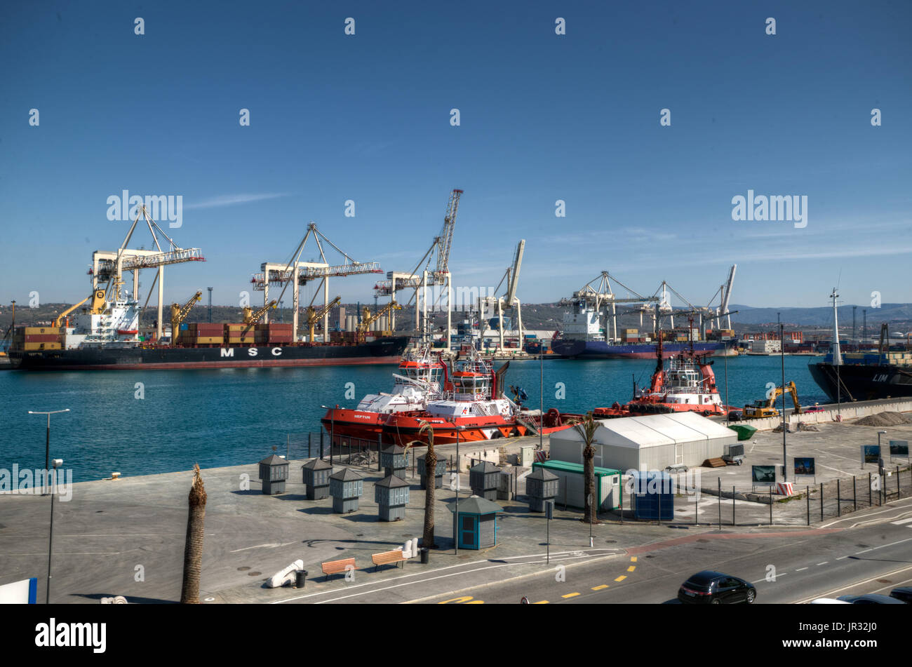Commercial harbour with a crane ship on the deck Stock Photo - Alamy