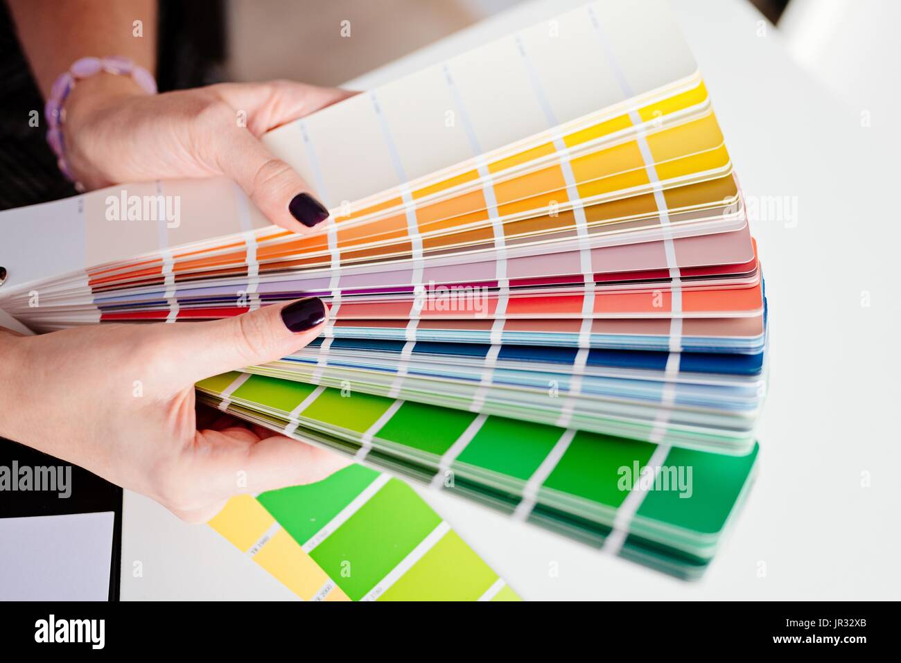 Woman designer or architect choosing color from color palette Stock ...