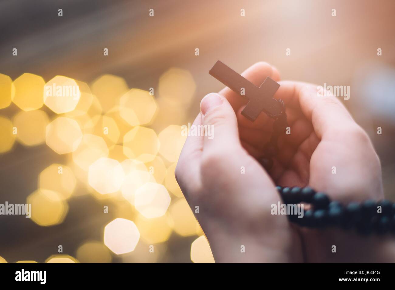 Child praying cross hi-res stock photography and images - Alamy