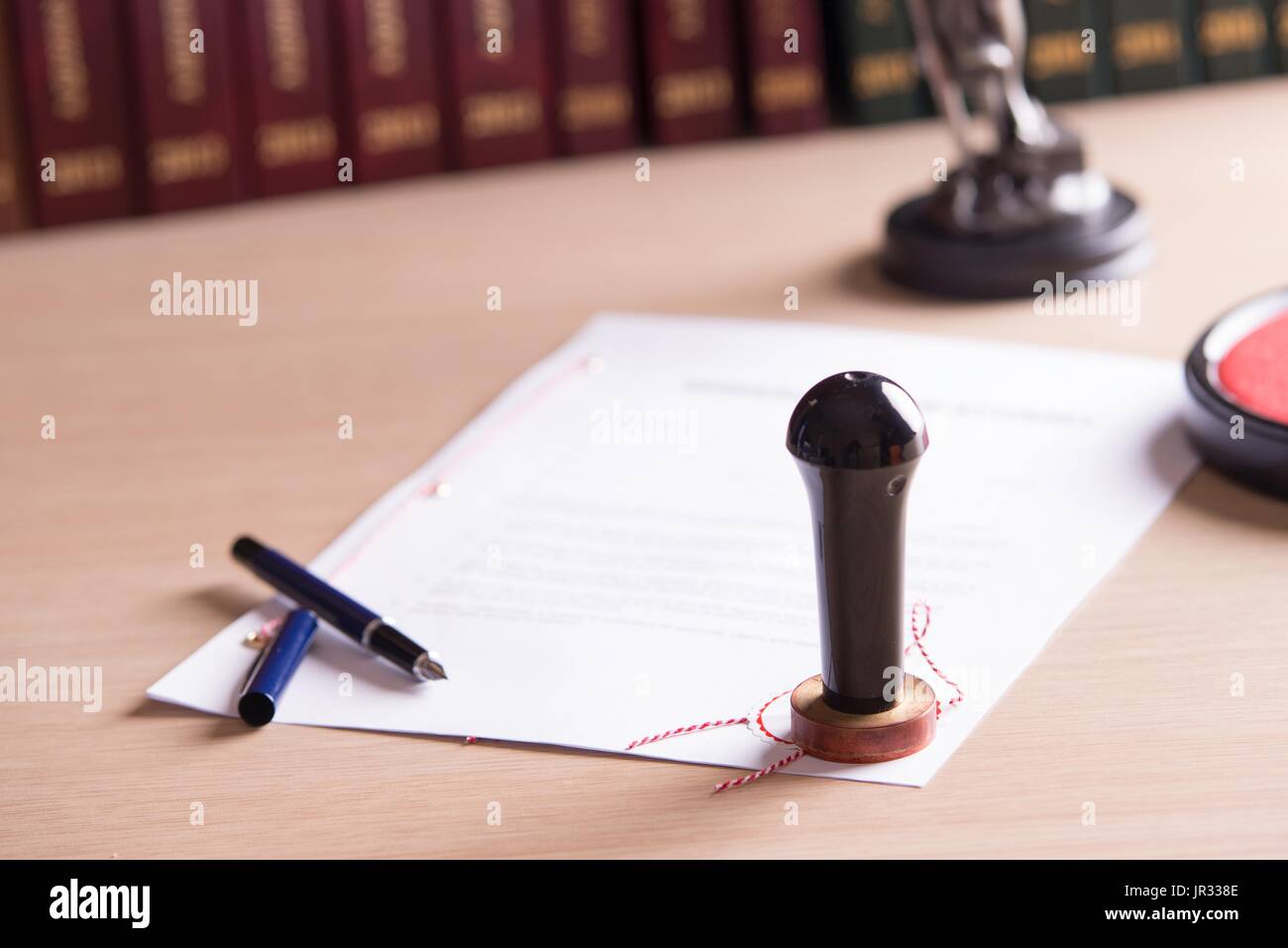 Stamp of the notary on testament and last will. In the background ...