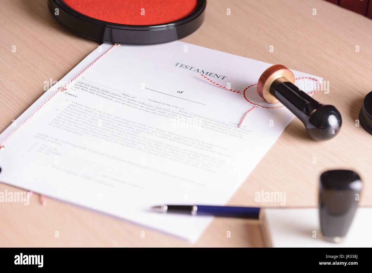 Stamp of notary public on last will. Notarial acts in the background ...
