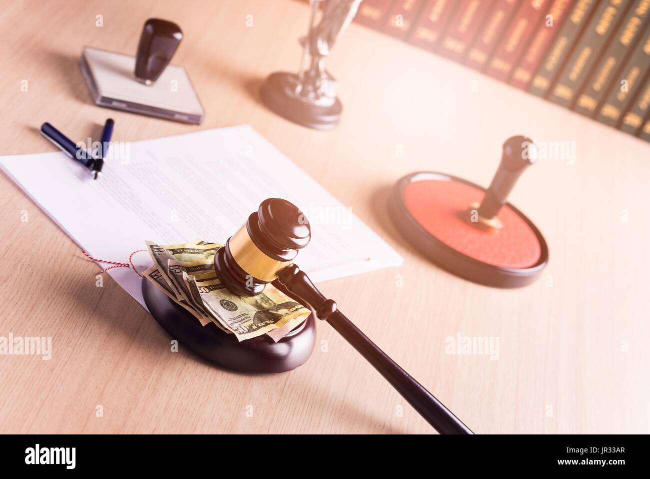 American money under the judge's gavel. Notary public stamper and ...