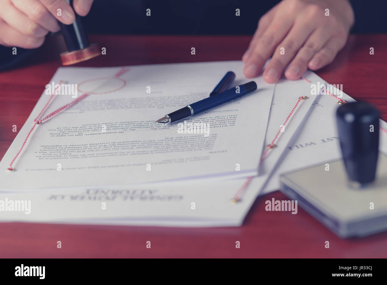 Notary stamps signed power of attorney in his notary's office Stock ...