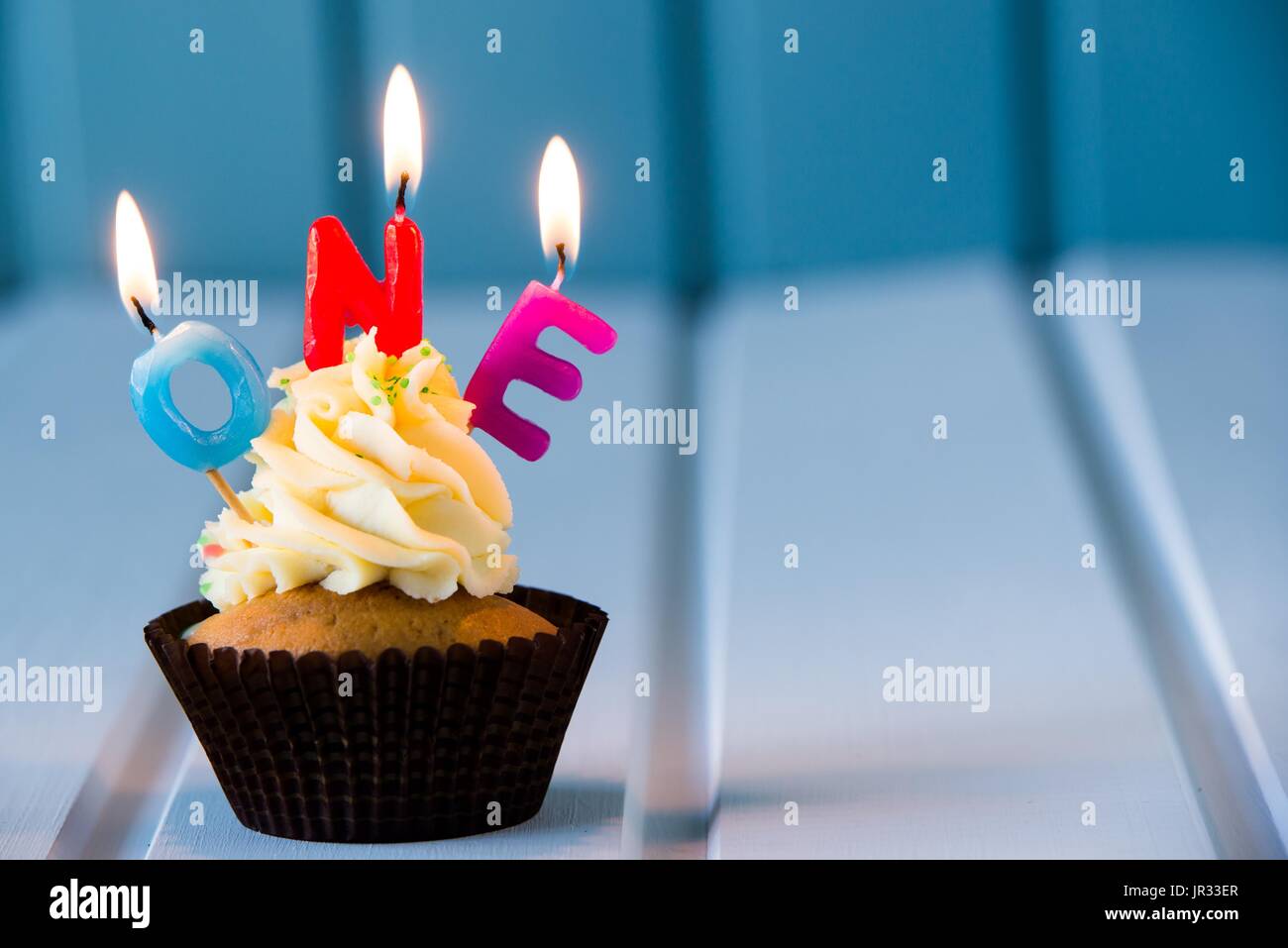 Birthday's cake - cupcake with a candles for 1 - first birthday . Happy ...