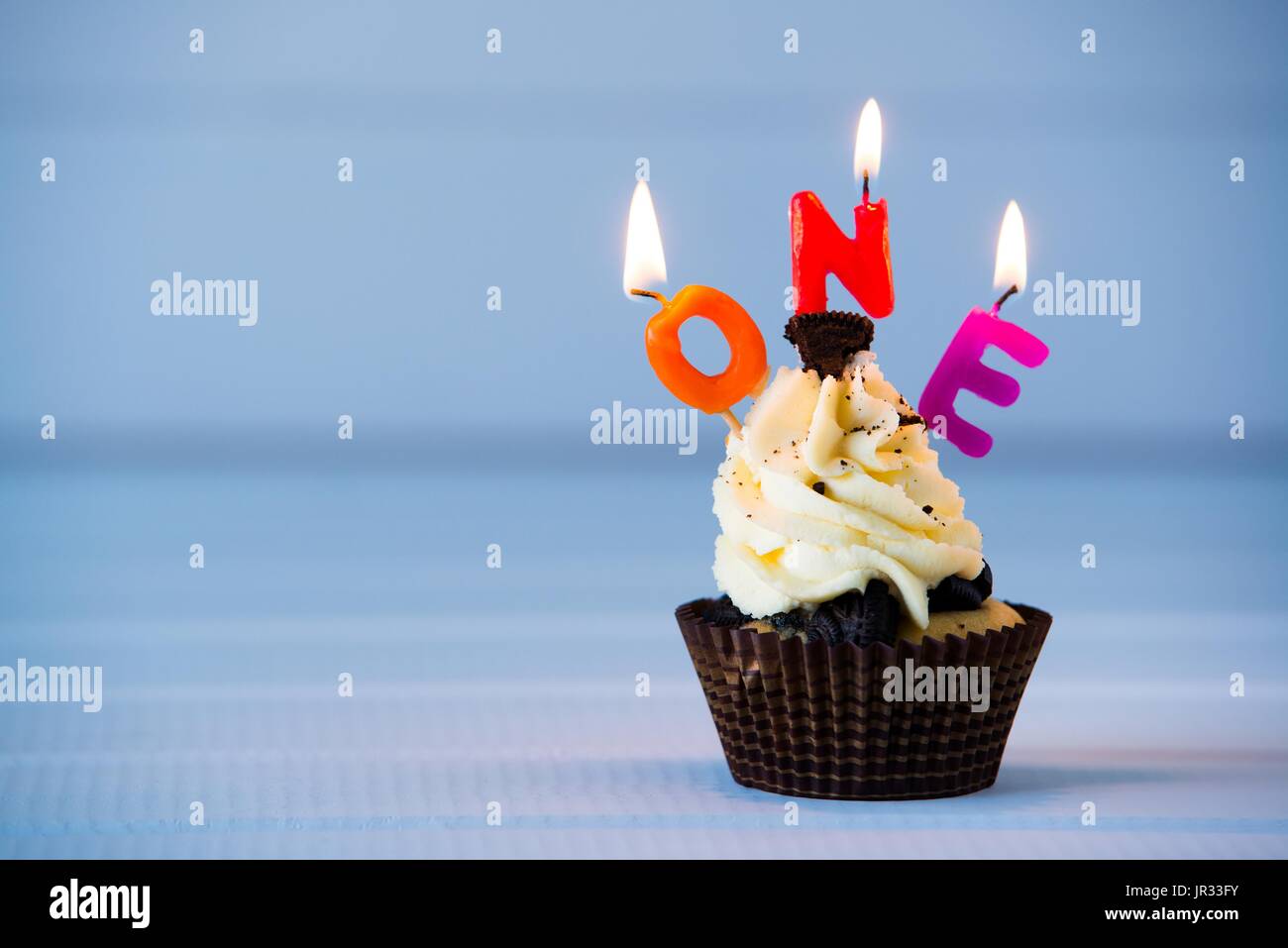 Birthday's cake - cupcake with a candles for 1 - first birthday . Happy ...
