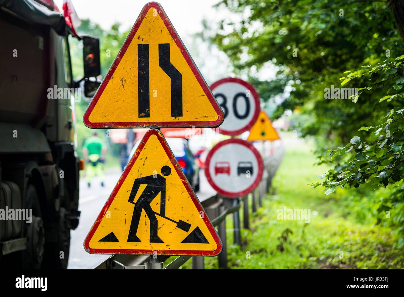 Summer road work. Road renewal. Traffic Jam Stock Photo - Alamy