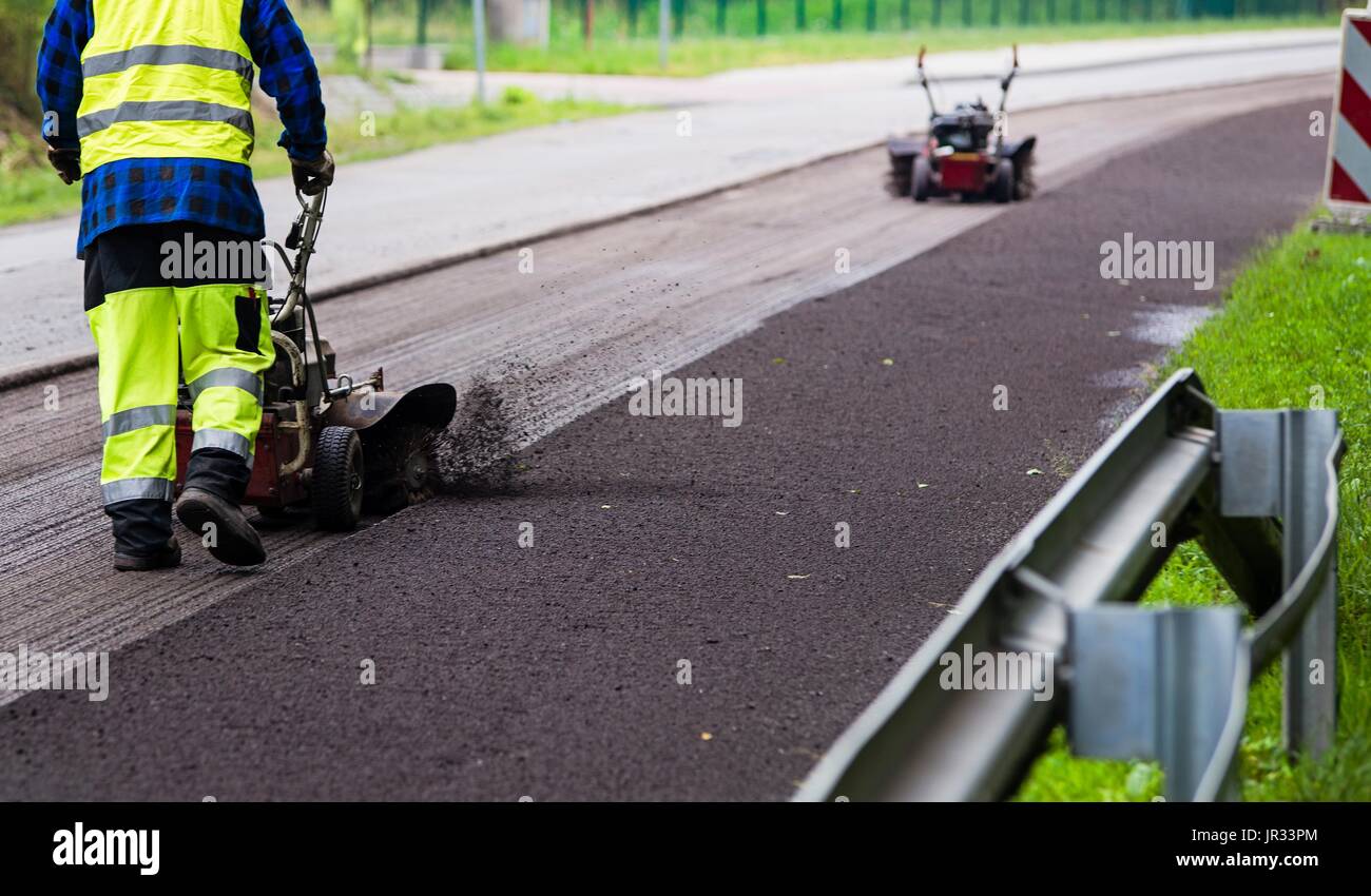 Summer road work. Road renewal. Traffic Jam Stock Photo - Alamy