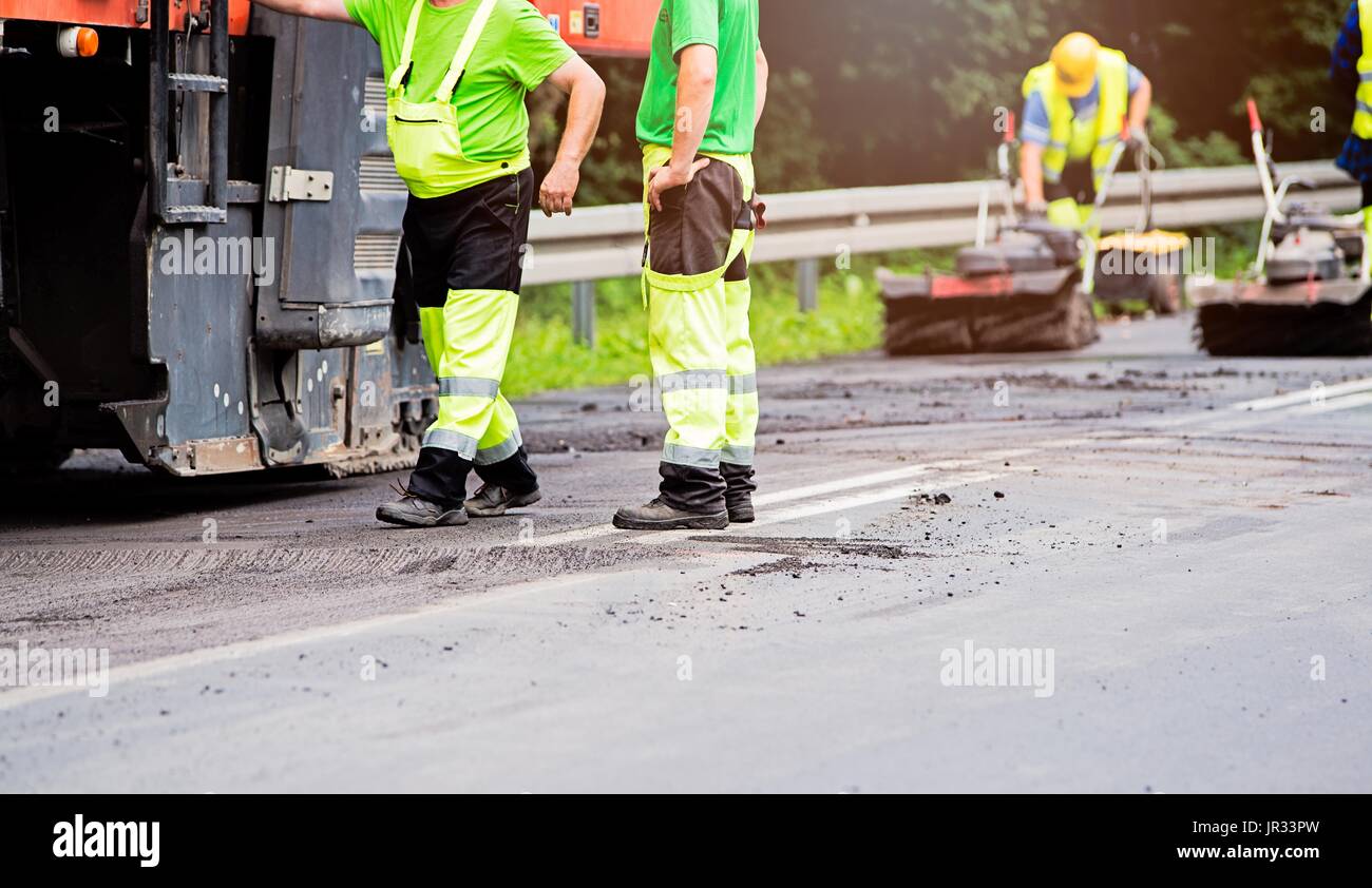Summer road work. Road renewal. Traffic Jam Stock Photo - Alamy