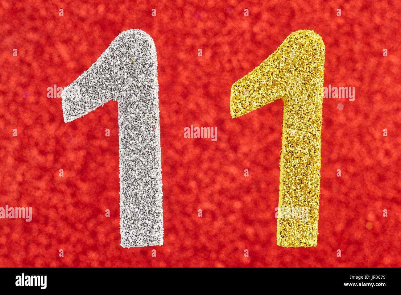 Number eleven silver yellow color over a red background. Anniversary ...