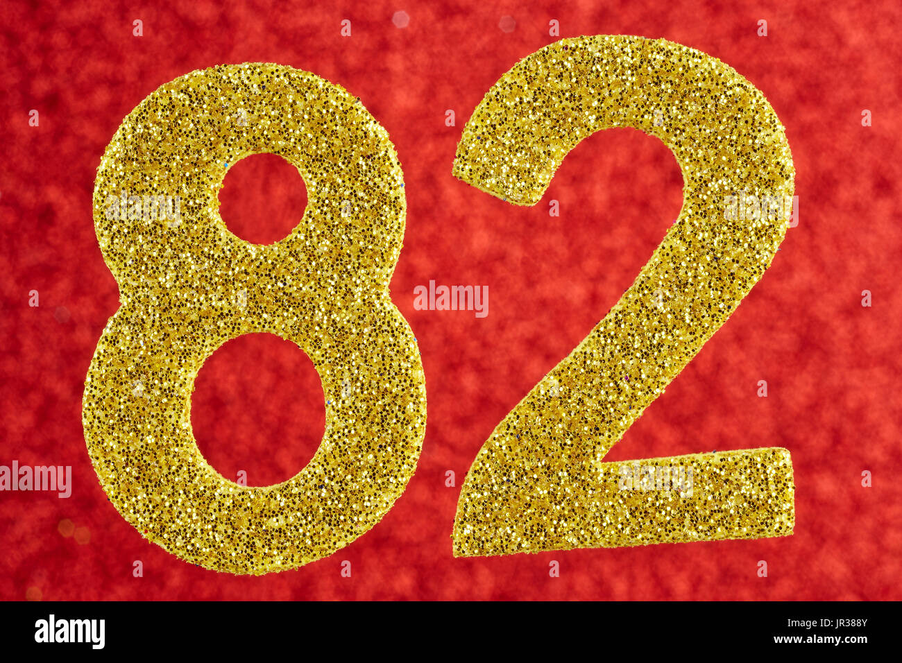 Number eighty-two yellow color over a red background. Anniversary ...