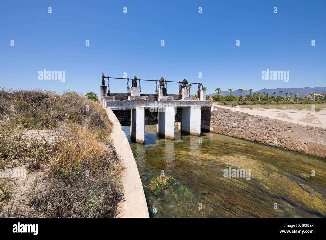 ancient open sluices in waterway river, next to Gurugu Beach in ...