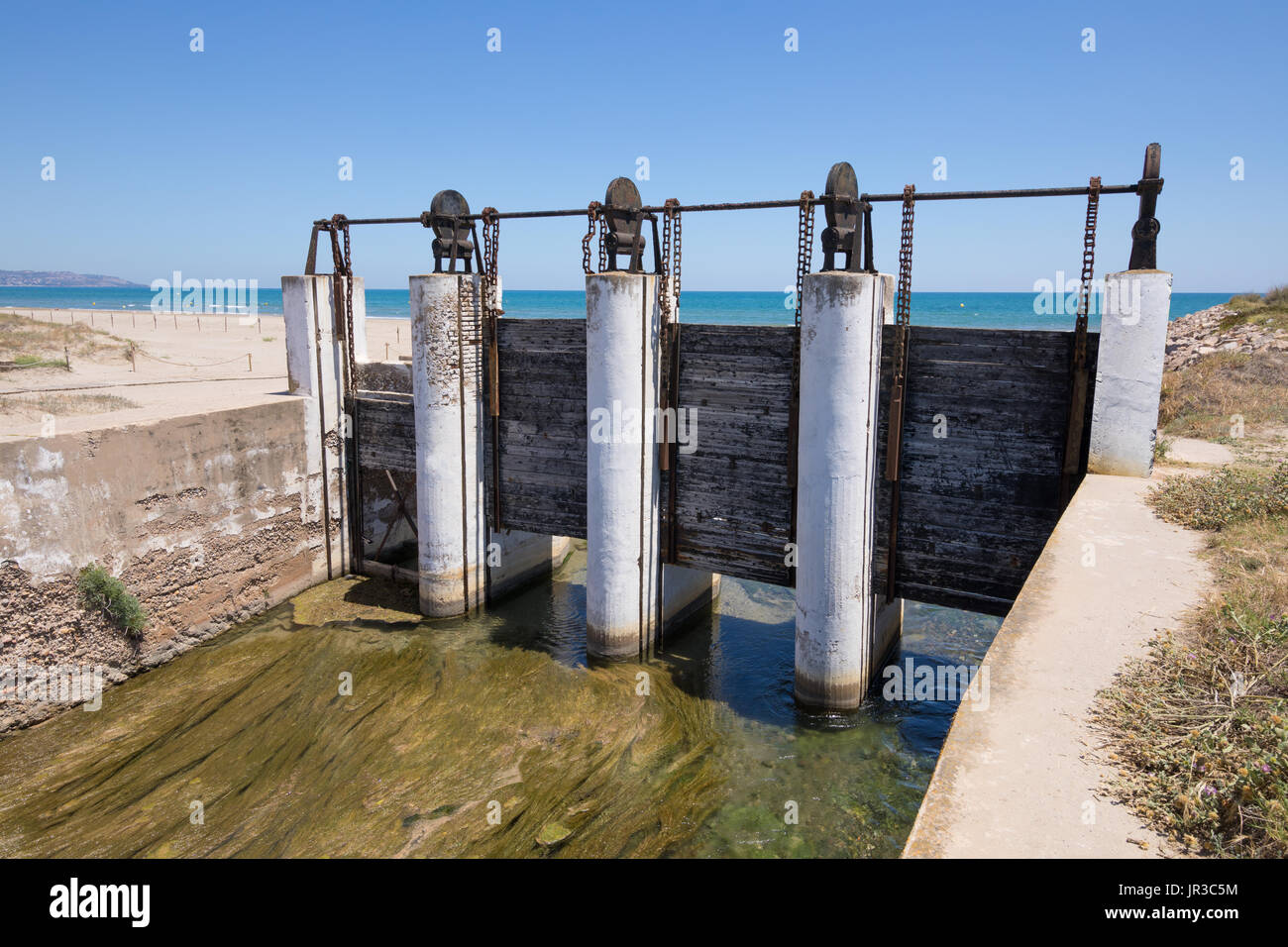 ancient sluices in waterway river towards Mediterranean Sea, next to ...