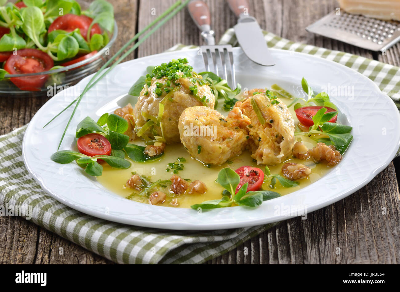 South Tyrolean bread dumplings with grey cheese, served with butter and ...