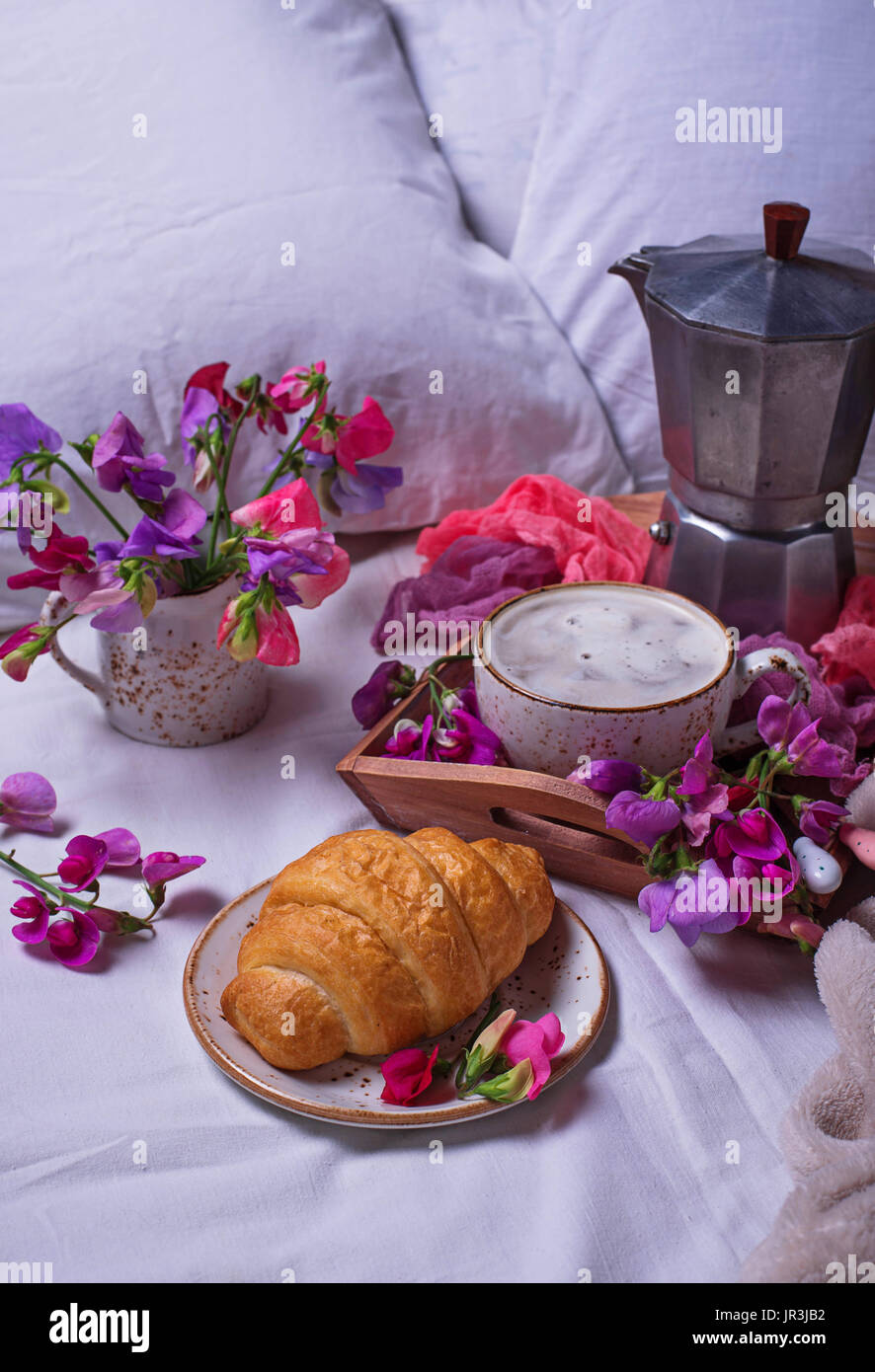Breakfast in bad. Croissants and cup of coffee Stock Photo - Alamy