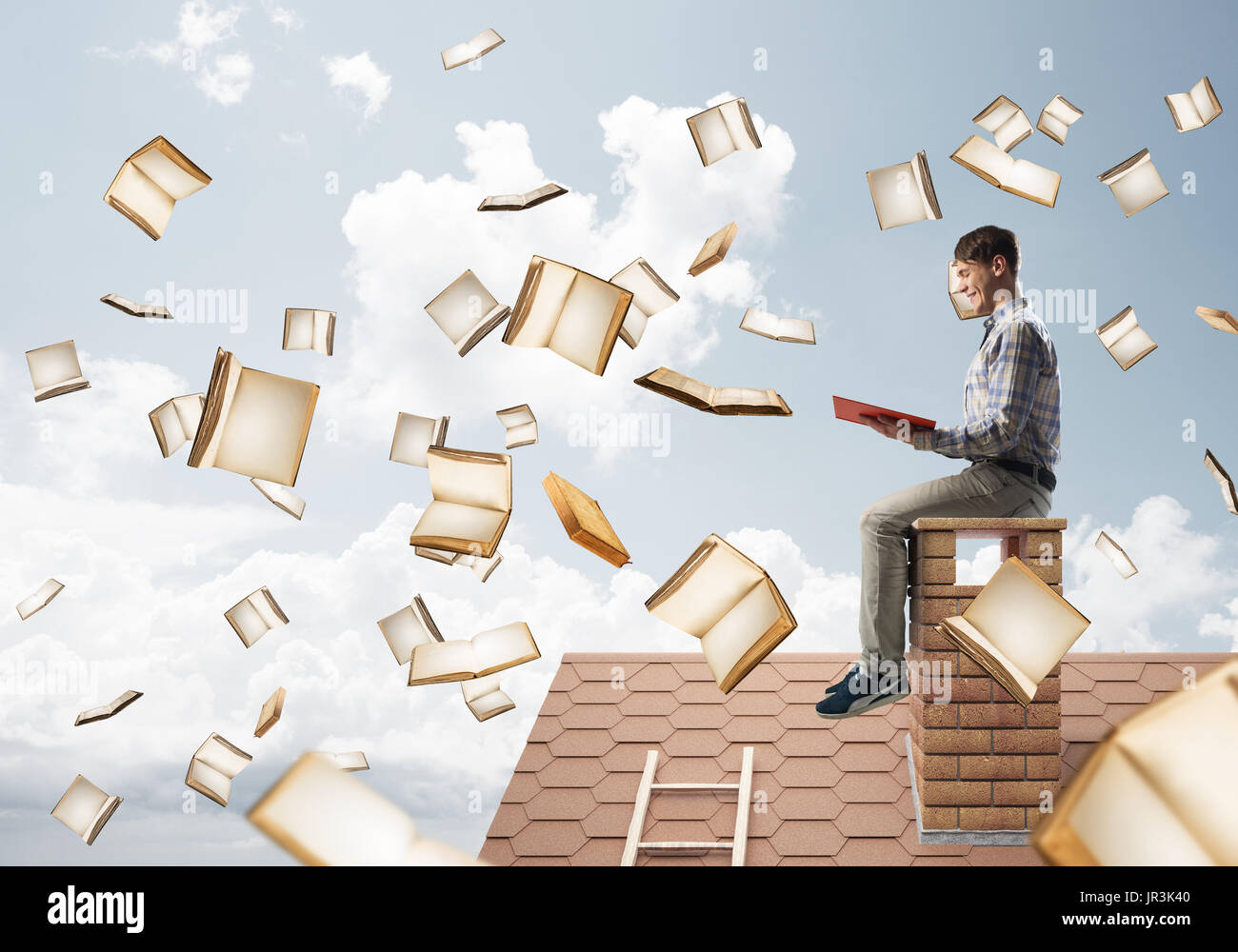 Man reading book and many of them flying in air Stock Photo - Alamy
